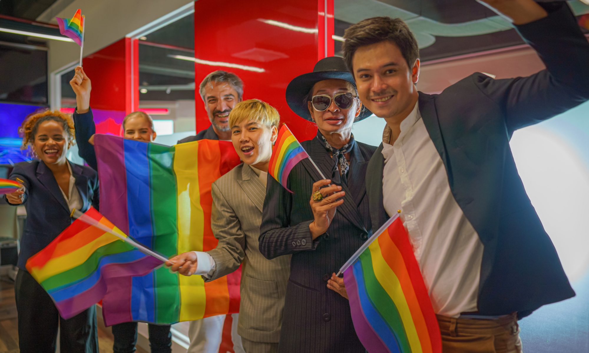 diverse group of lgbtq people with rainbow flag on hand team up : リュウカツ ...